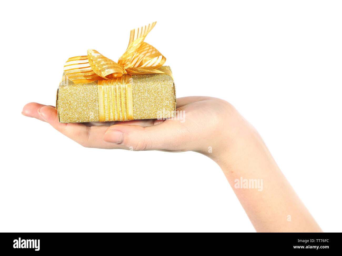 Female hand holding present box with ribbon on light background Stock ...