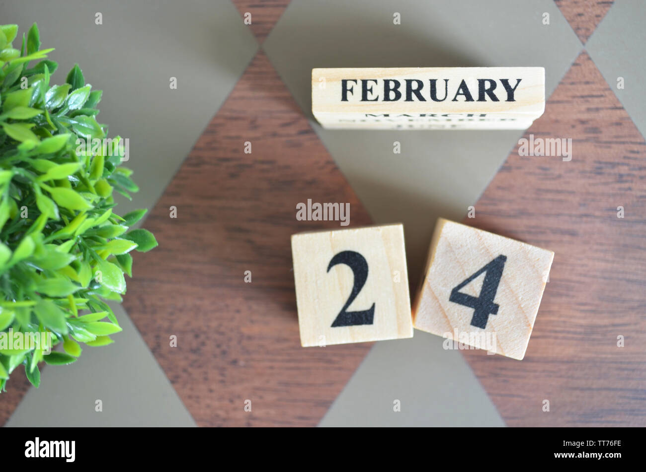 Date of February with leaf on diamond pattern table for background ...
