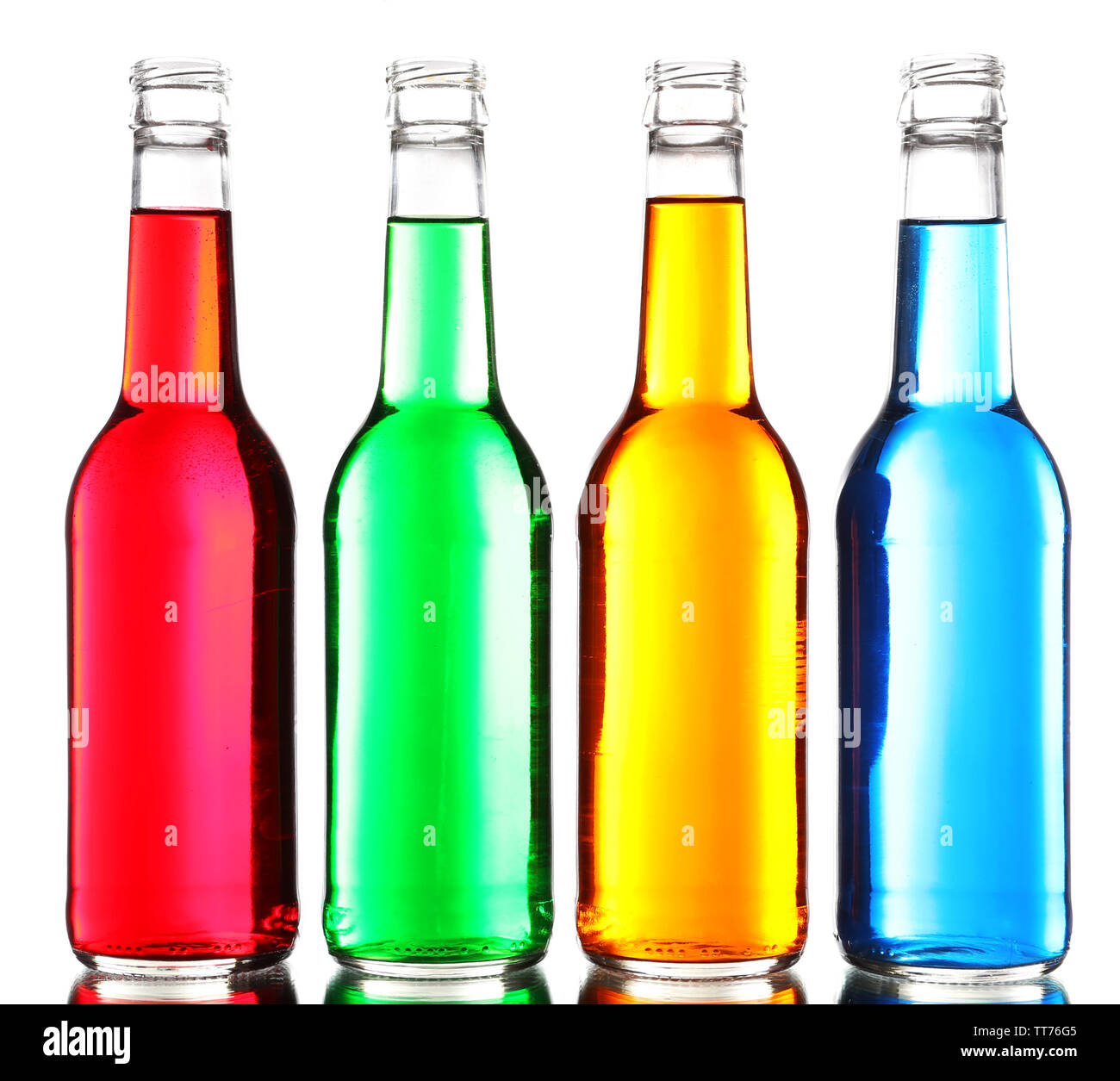 Colorful alcoholic beverages in glass bottles isolated on white Stock ...