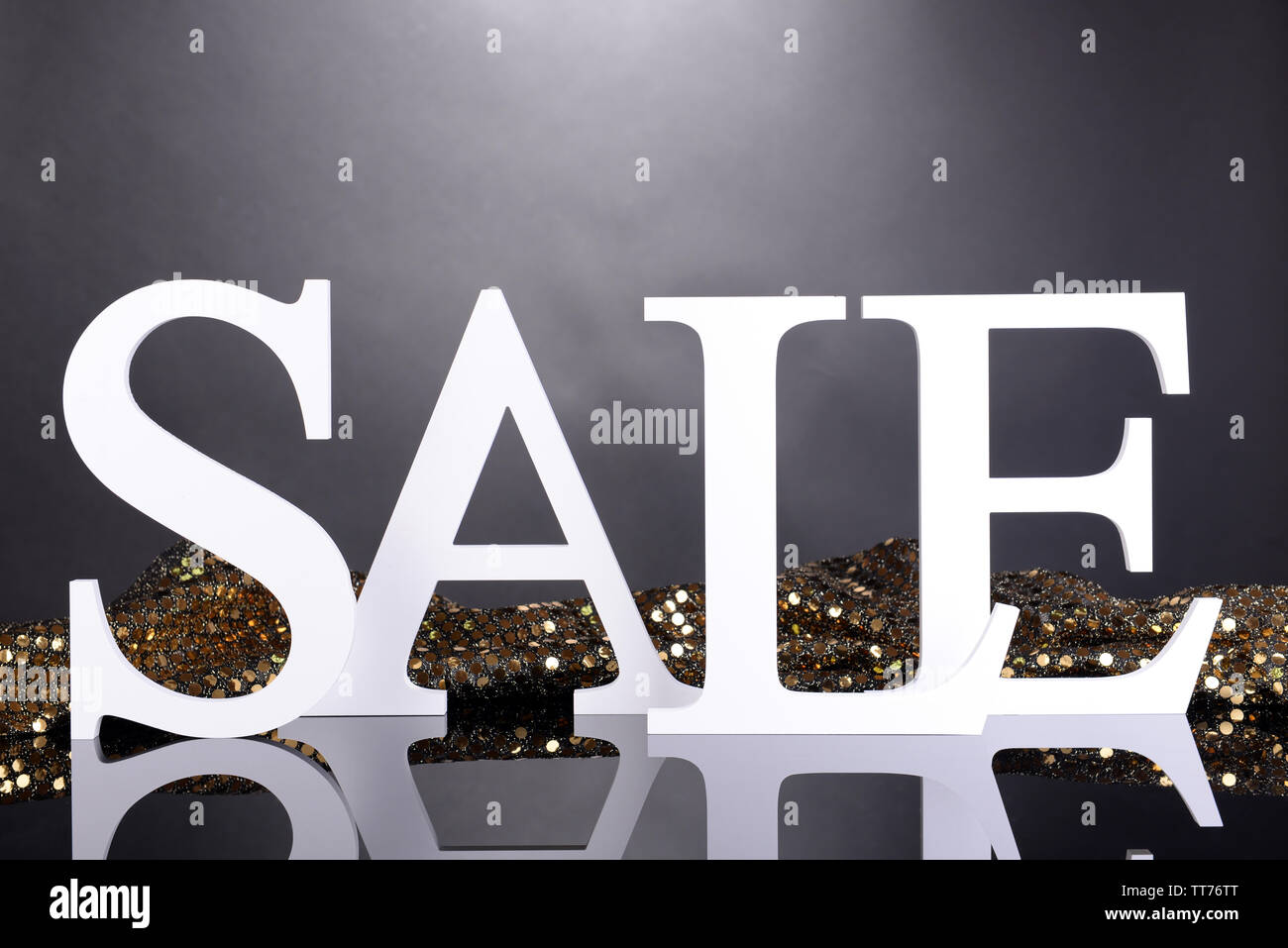 Sale on grey background Stock Photo - Alamy