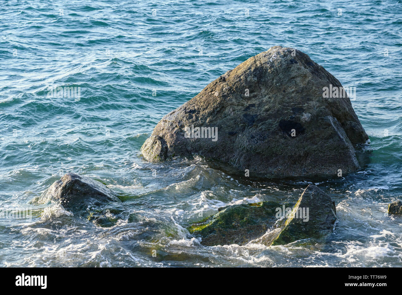 Waves at the seashore. Selective focus with shallow depth of field ...
