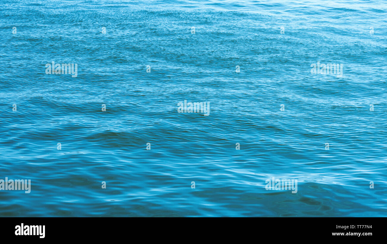 Sea surface as natural background, color toned Stock Photo - Alamy