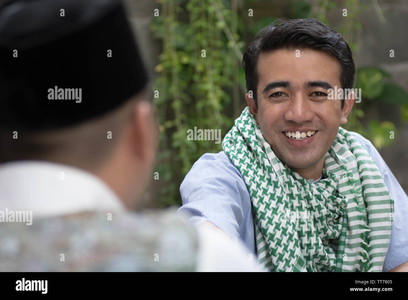 two man having hand shake at dining table during lunch and diner during ...
