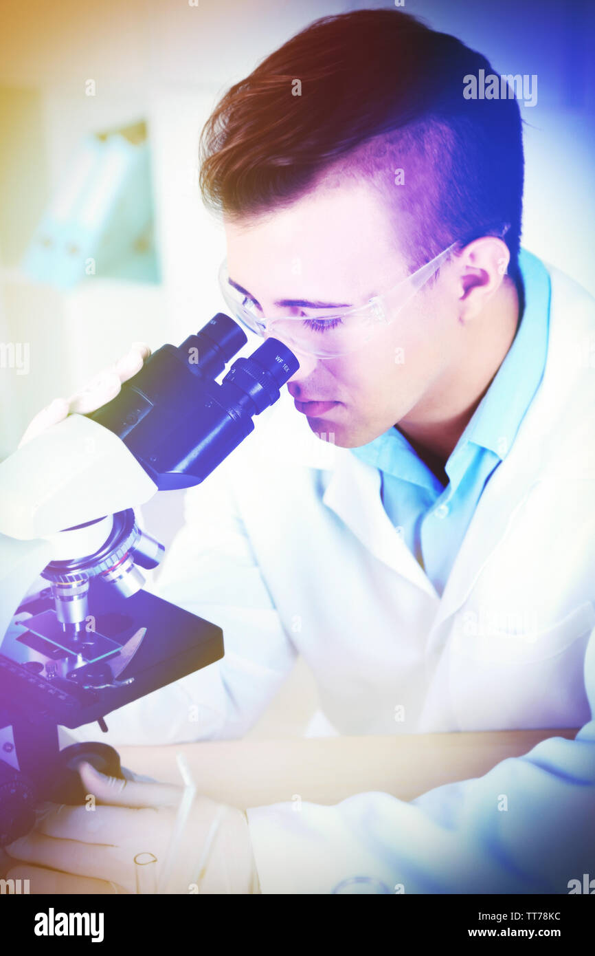Young male researcher carrying out scientific research in lab Stock ...