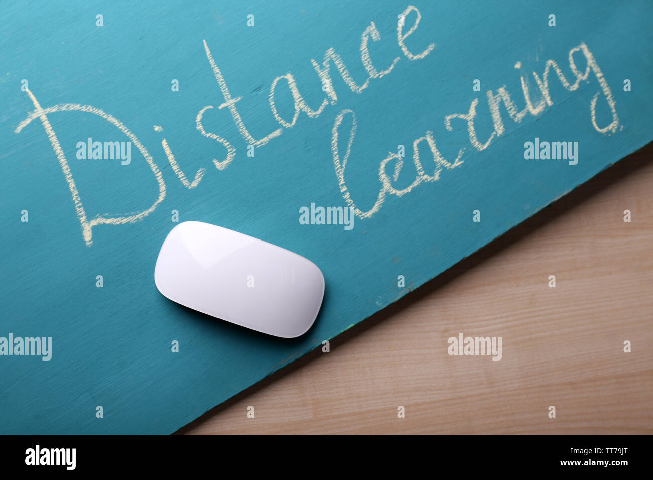 Computer mouse and inscription Distance Learning on blackboard on ...