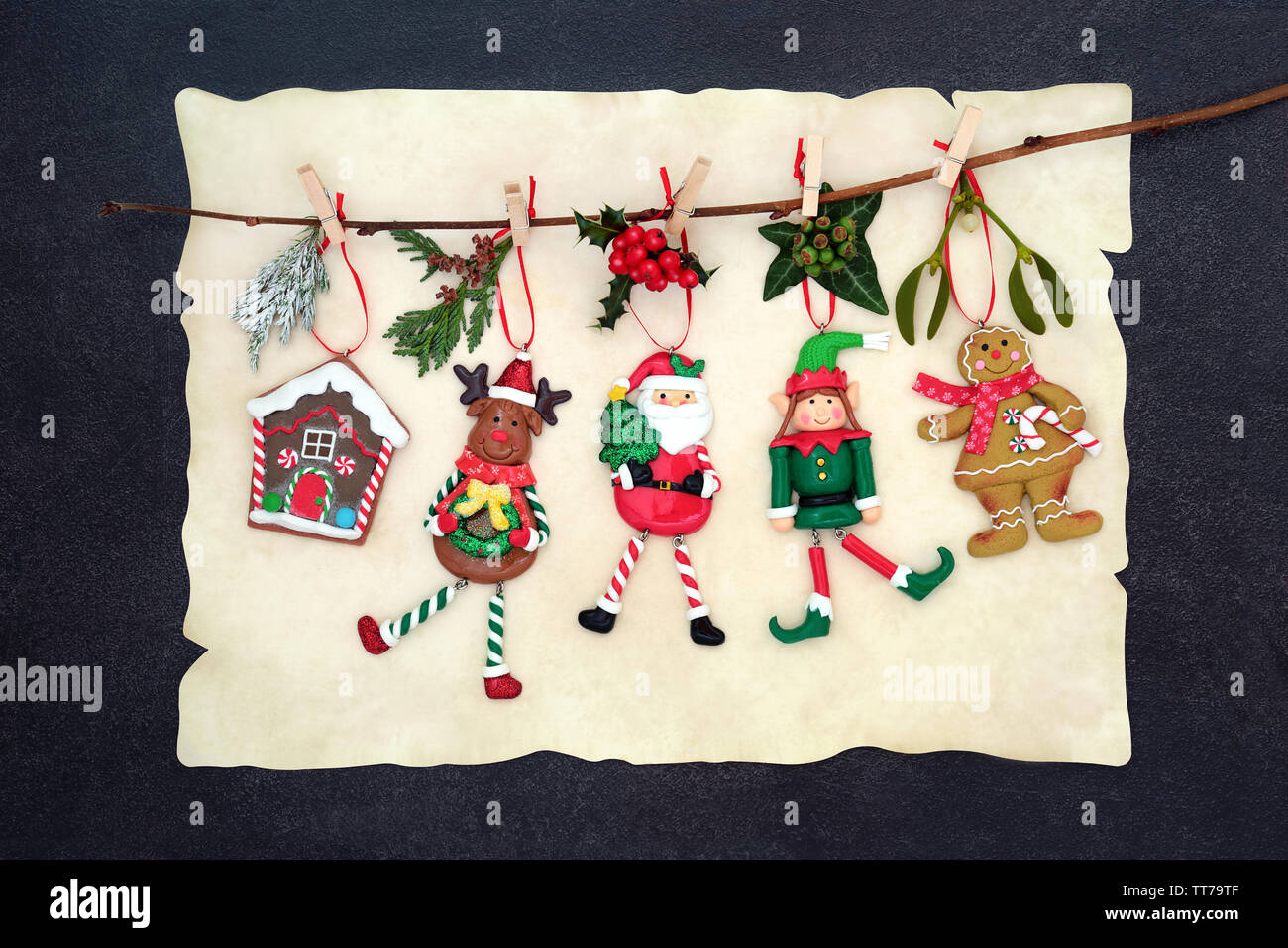 Christmas tree decorations hanging on a branch with santa claus ...