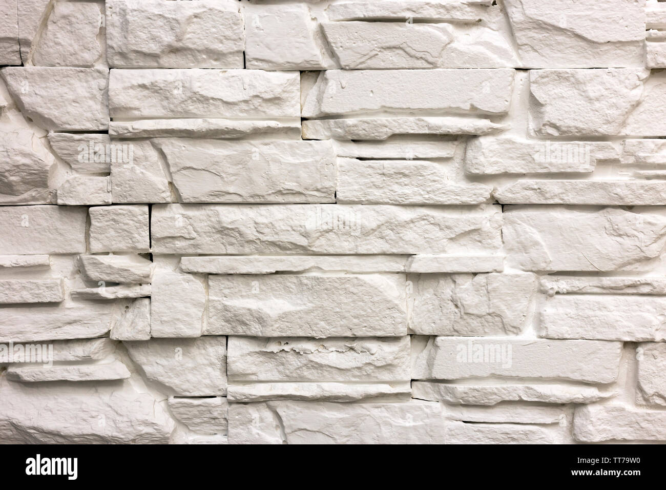 Close-up of white solid limestone wall or stone fence. Abstract copy ...