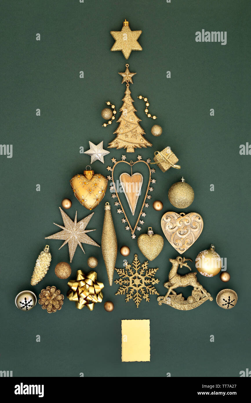 Abstract Christmas tree decoration with gold baubles, ornaments and ...