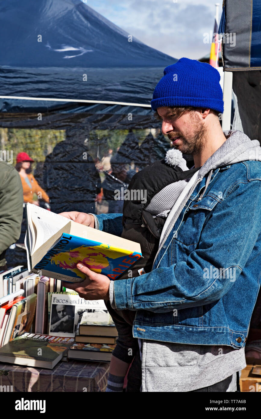 A man reads a book at Clunes Booktown festival in the 1850`s gold ...