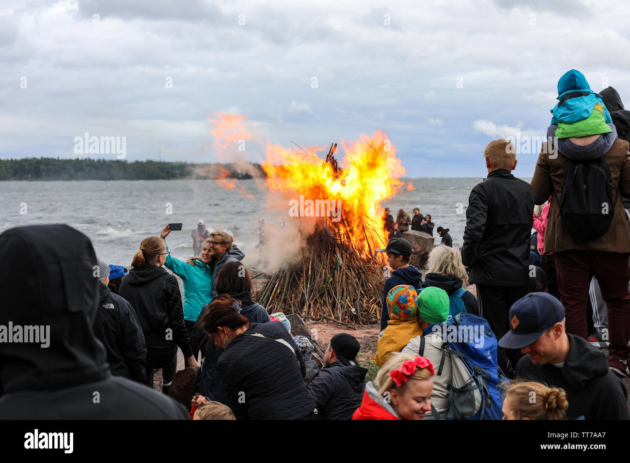 Traditional midsummer bonfire by the sea in Lauttasaari district ...