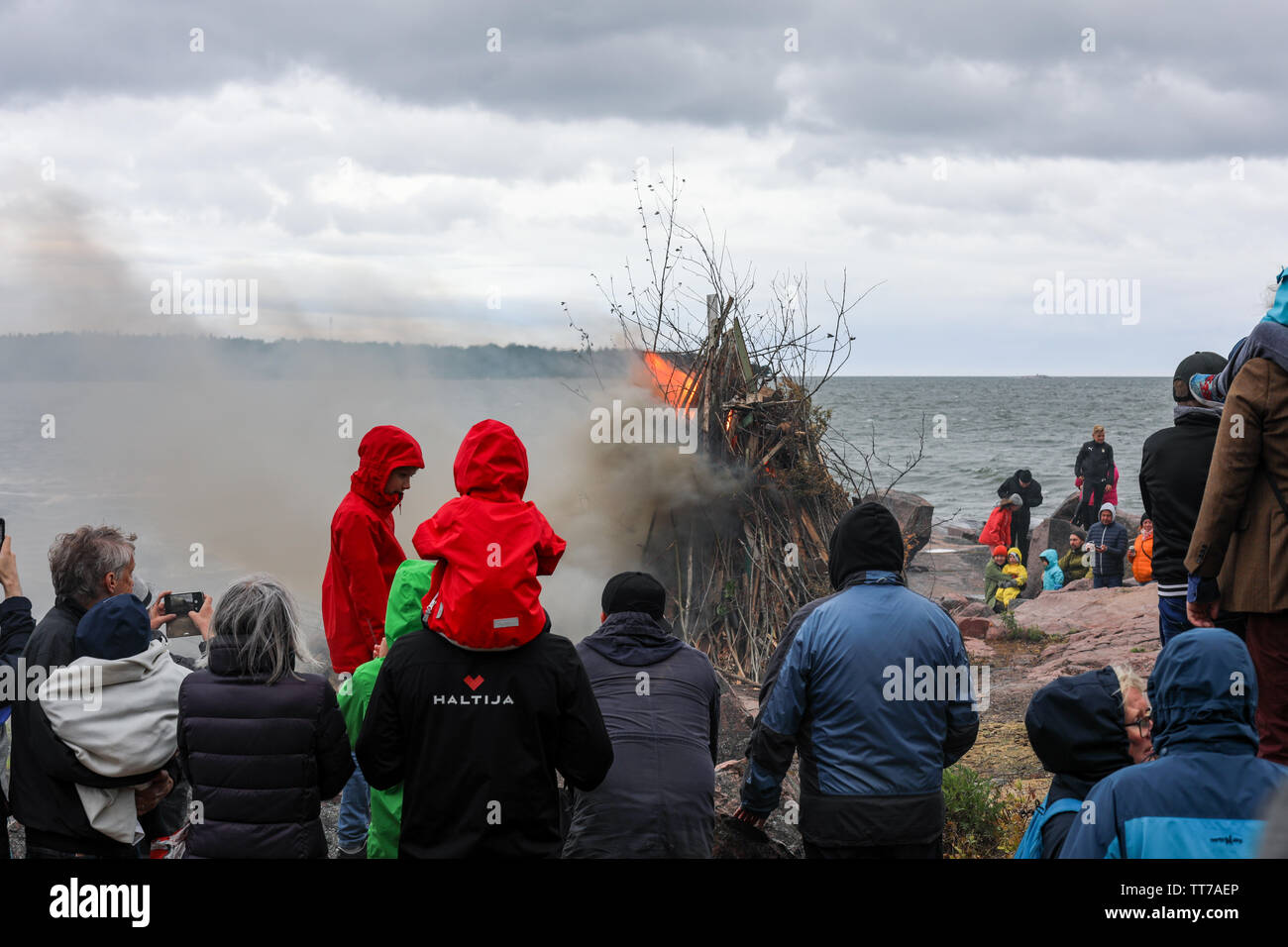 Traditional midsummer bonfire by the sea in Lauttasaari district ...
