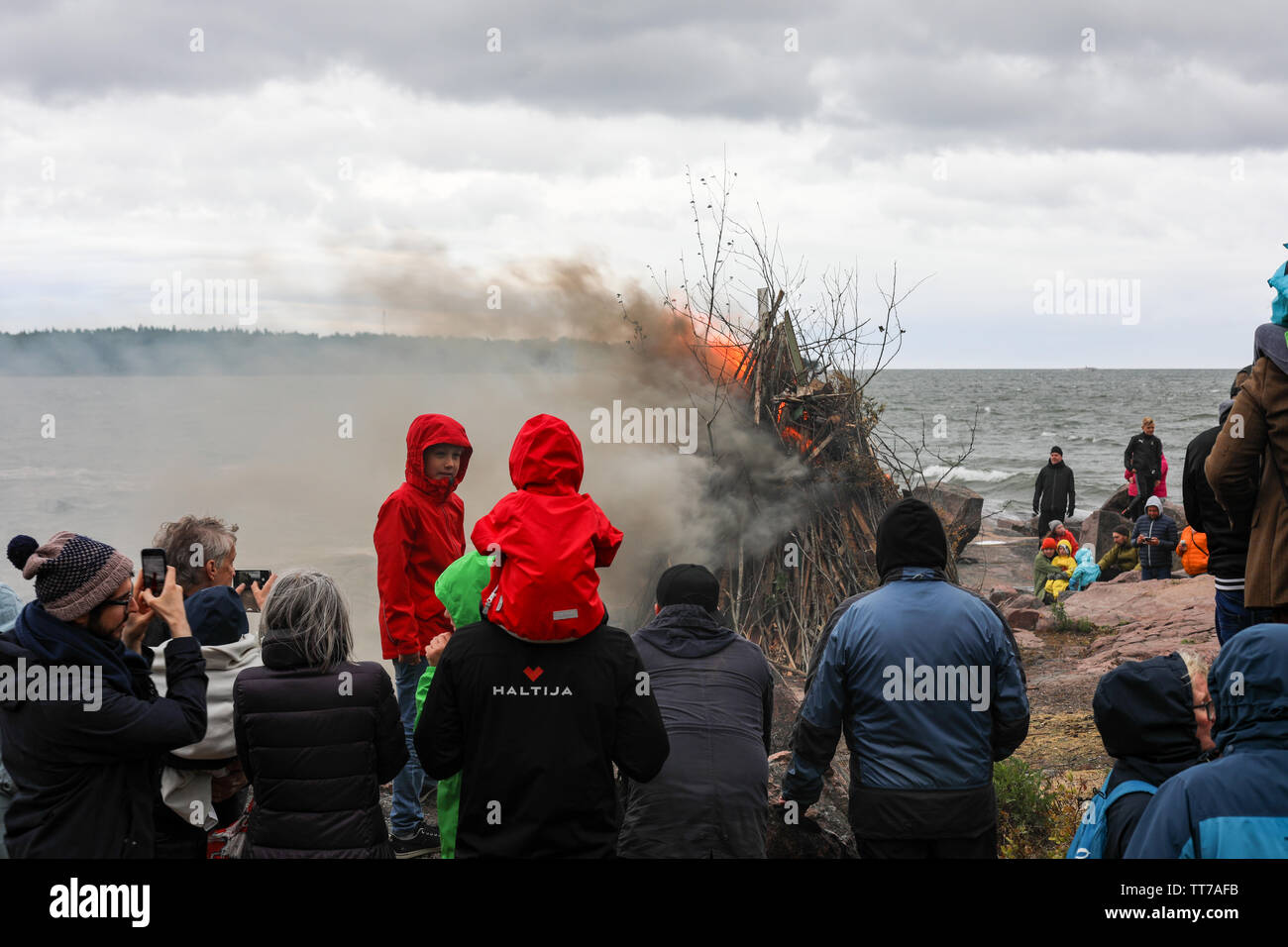 Traditional midsummer bonfire by the sea in Lauttasaari district ...