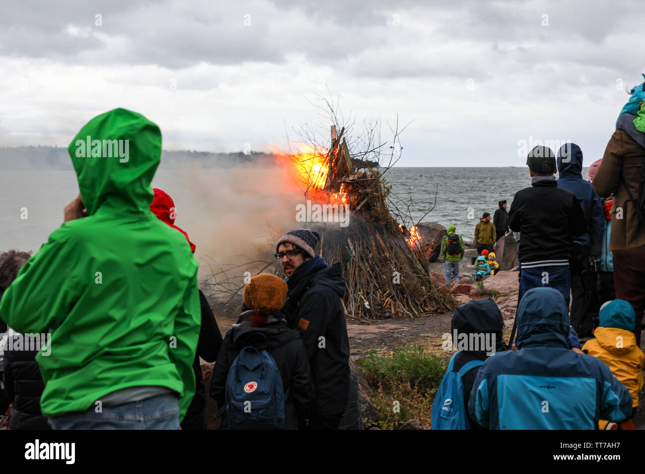 Traditional midsummer bonfire by the sea in Lauttasaari district ...