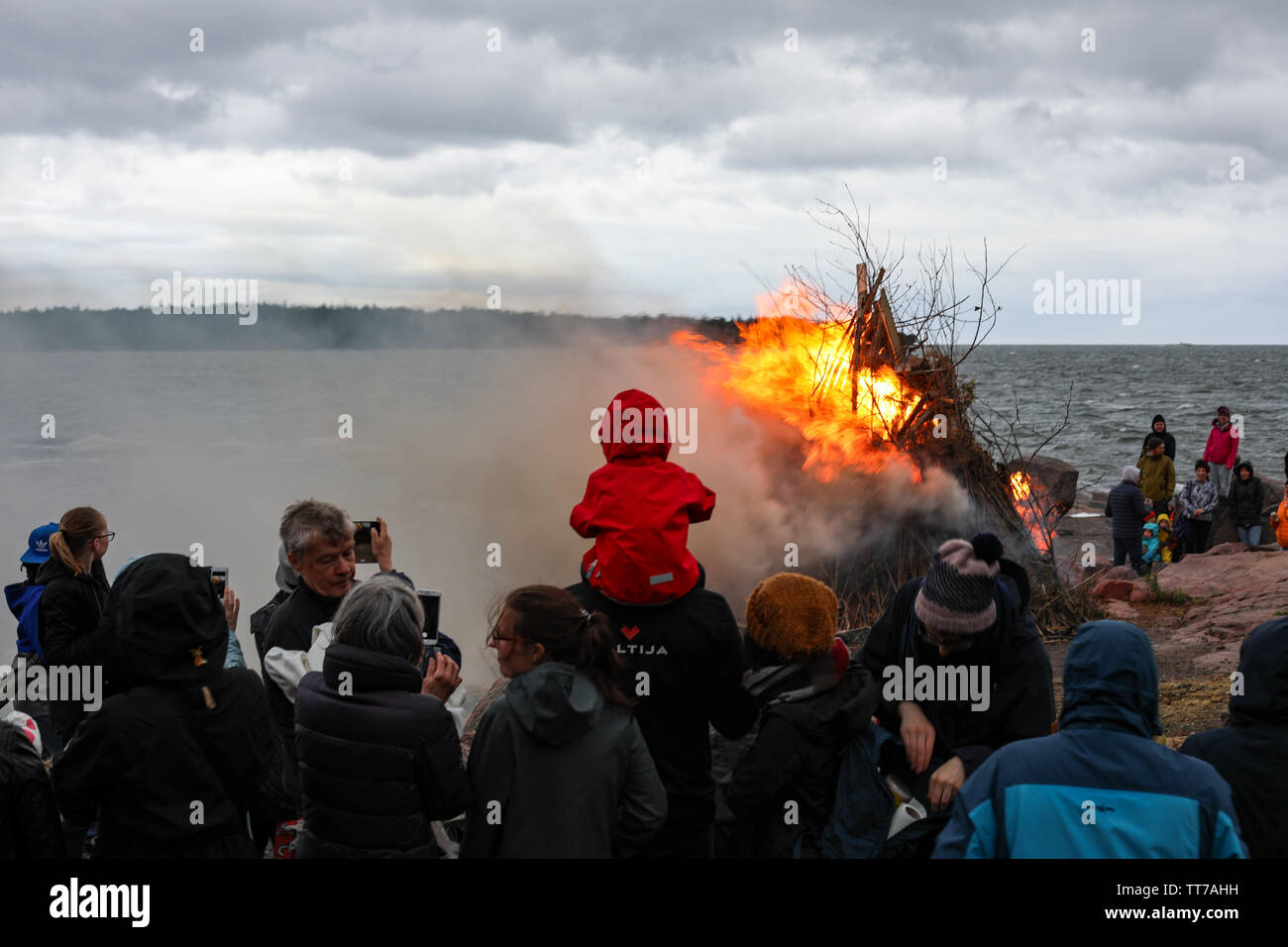 Traditional midsummer bonfire by the sea in Lauttasaari district ...