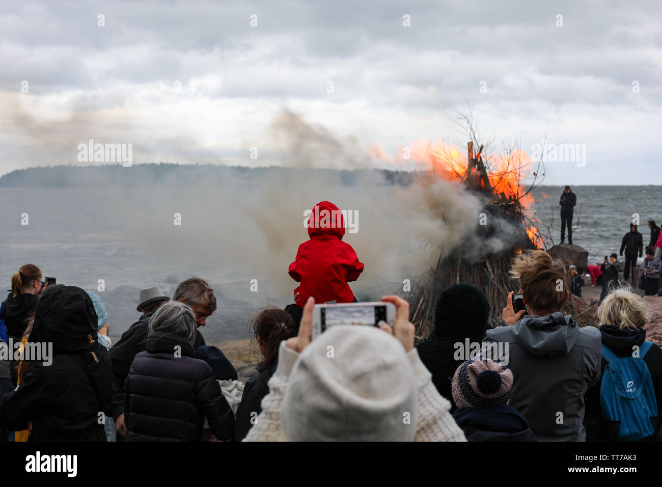 Traditional midsummer bonfire by the sea in Lauttasaari district ...