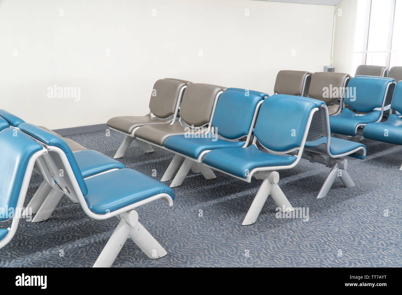 Empty airport terminal waiting area with chairs Stock Photo - Alamy