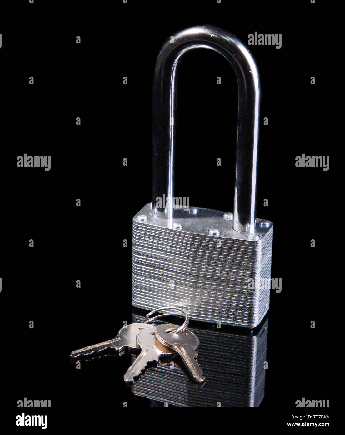 Padlock with keys isolated on black Stock Photo - Alamy