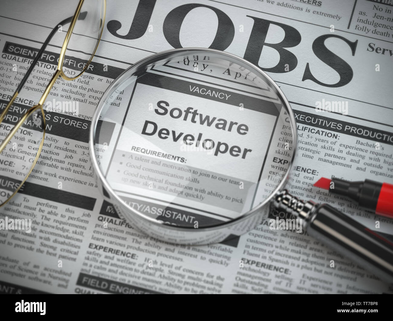 Software developer vacancy in the ad of job search newspaper with loupe ...