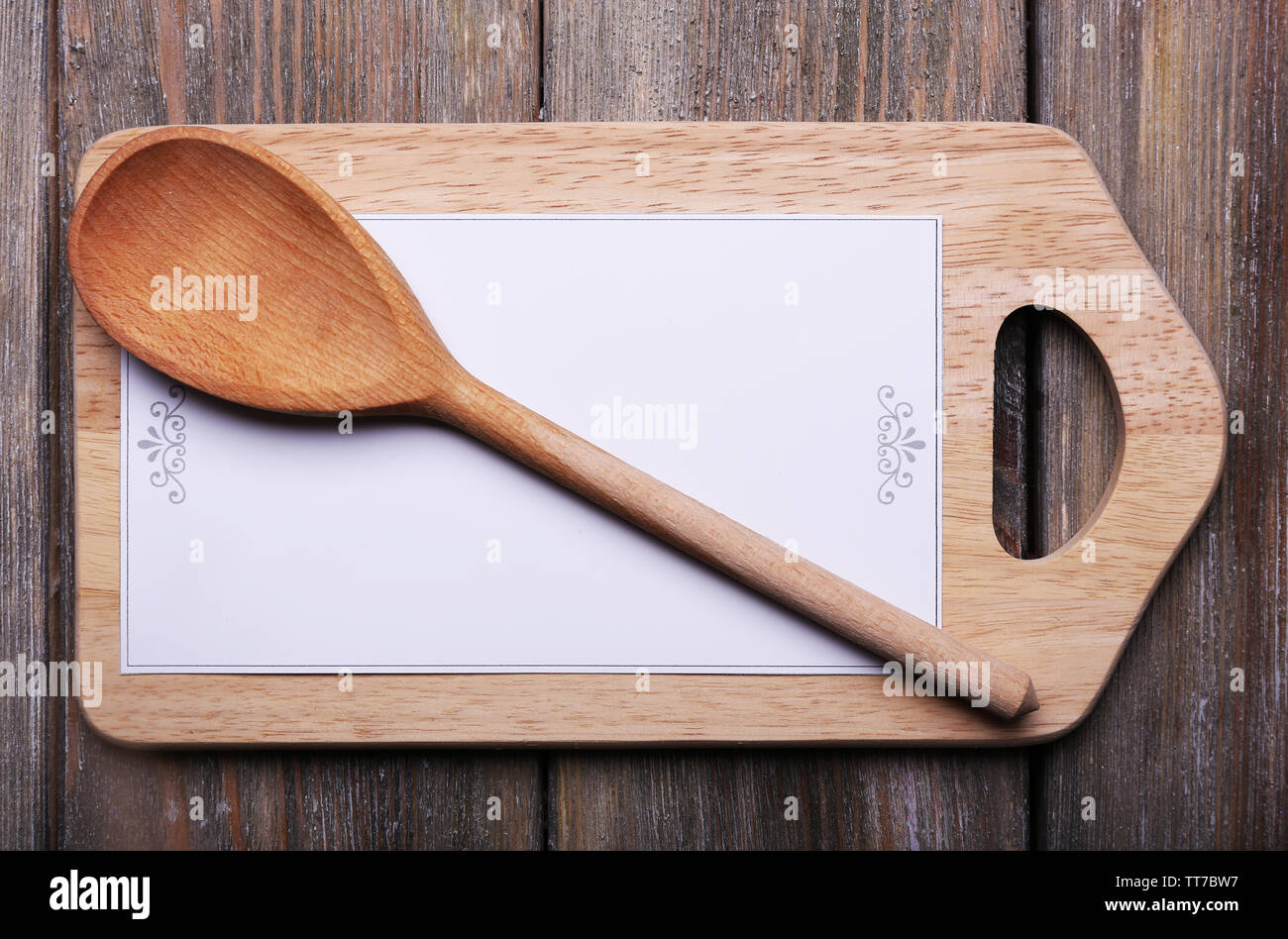 Cutting board with menu sheet of paper on rustic wooden planks ...