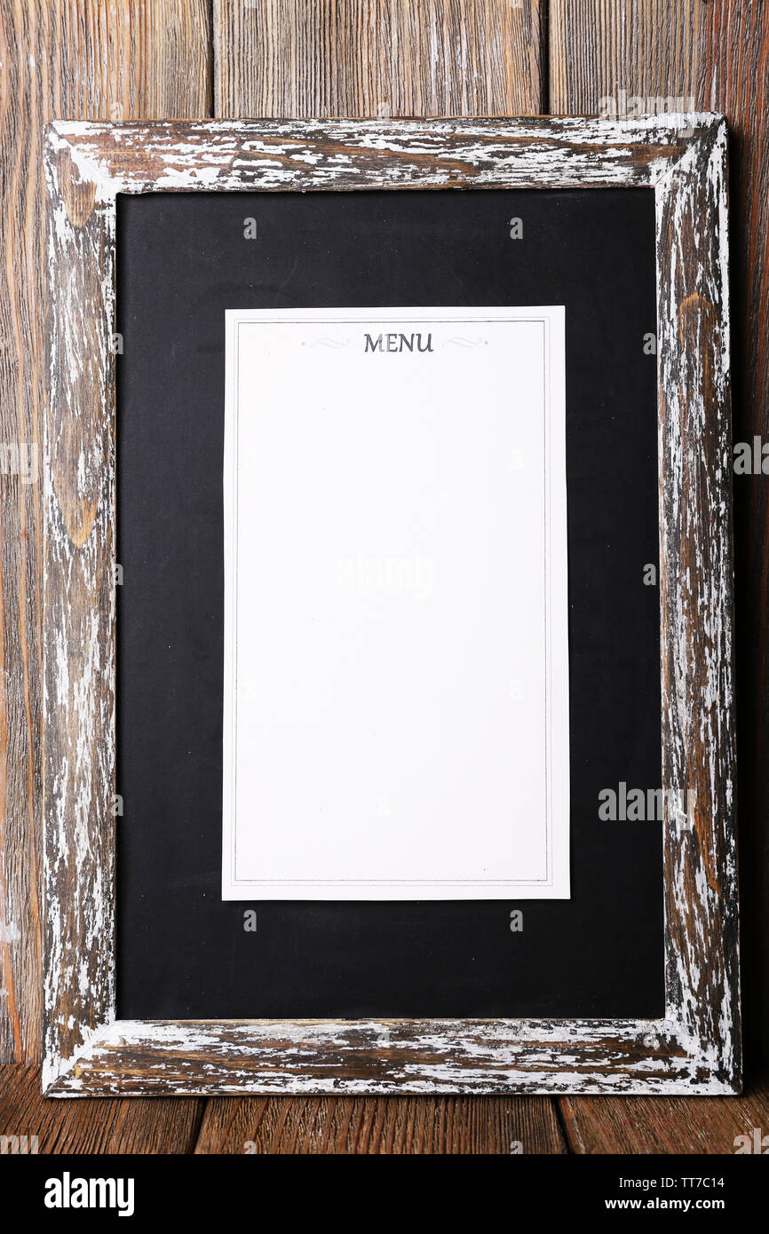 Menu board on rustic wooden planks background Stock Photo - Alamy