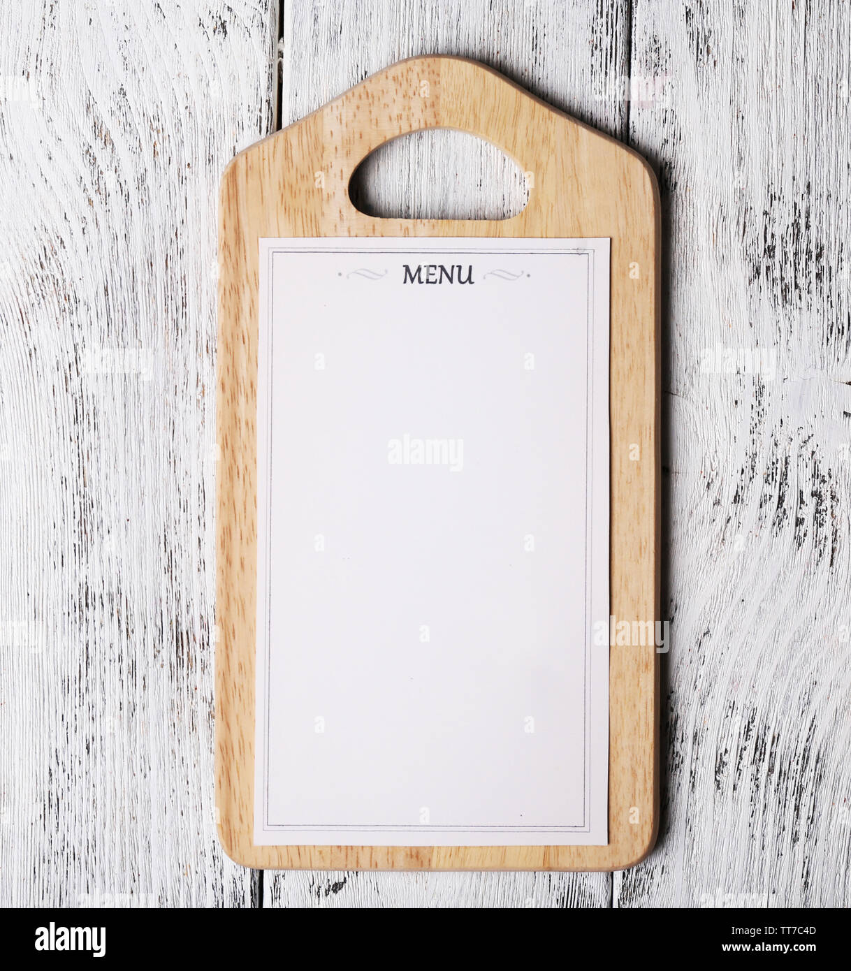 Cutting board with menu sheet of paper on color wooden background Stock ...