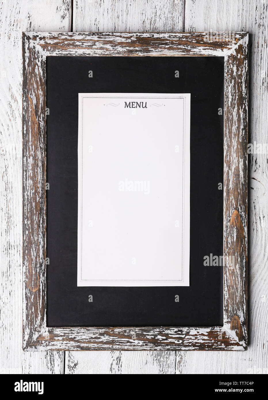 Menu board on color wooden planks background Stock Photo - Alamy