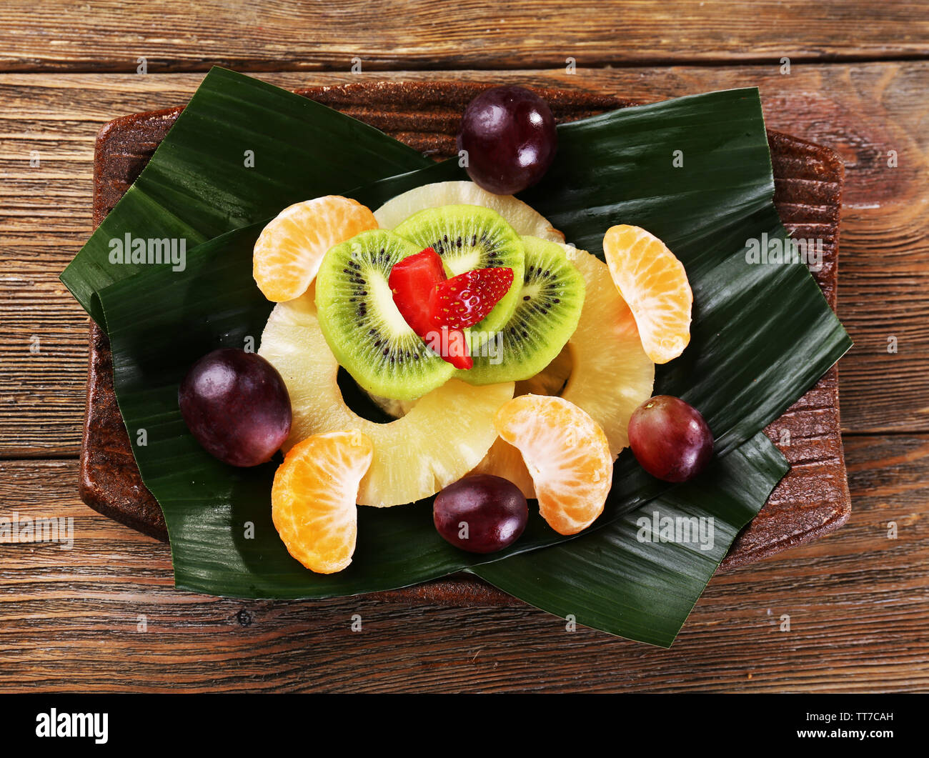 Fruit dessert on green leaf on table Stock Photo - Alamy