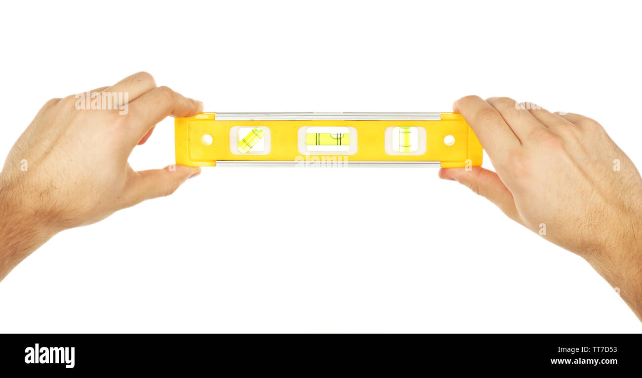 Male hands with ruler level isolated on white Stock Photo - Alamy