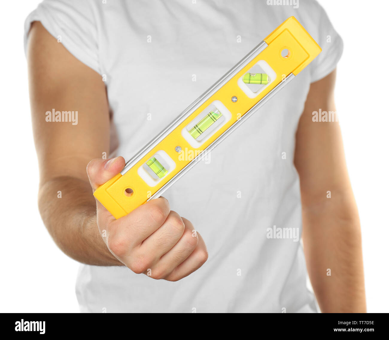Male hand with ruler level isolated on white Stock Photo - Alamy