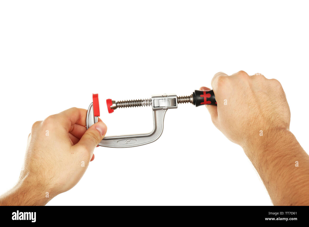 Clamp tool in male hand isolated on white Stock Photo - Alamy