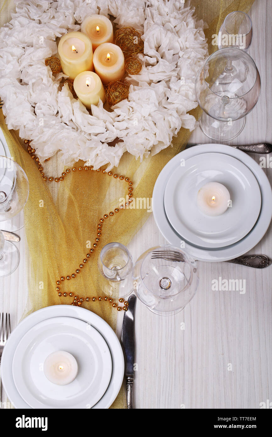Beautiful holiday table setting in white and gold color Stock Photo - Alamy