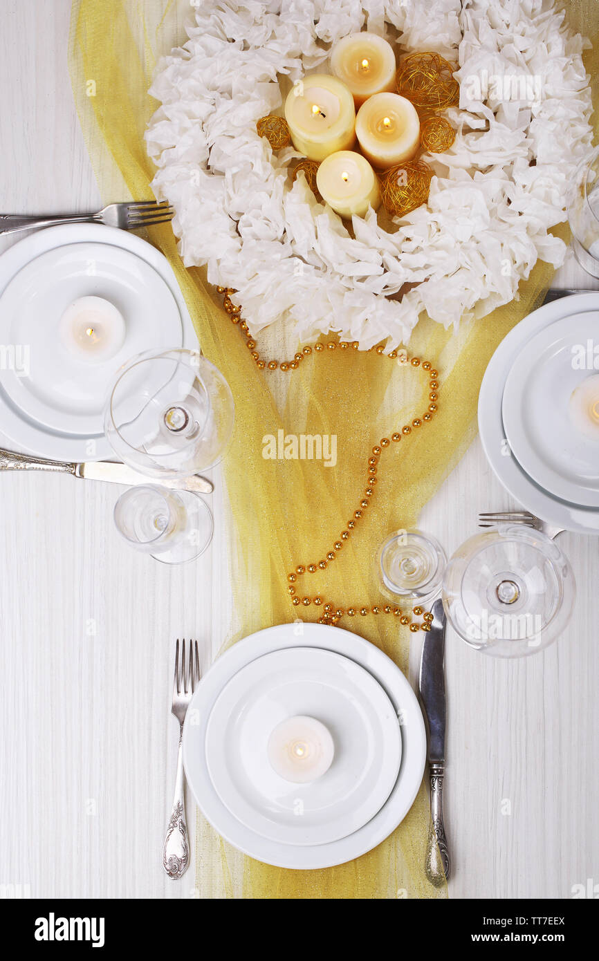 Beautiful holiday table setting in white and gold color Stock Photo - Alamy