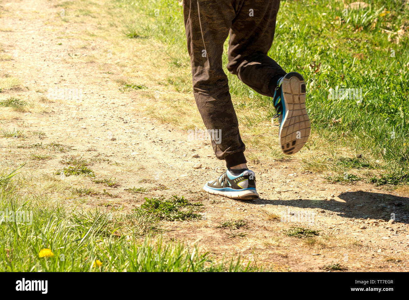 Runner man running on a rural road. Healthy or active life concept ...