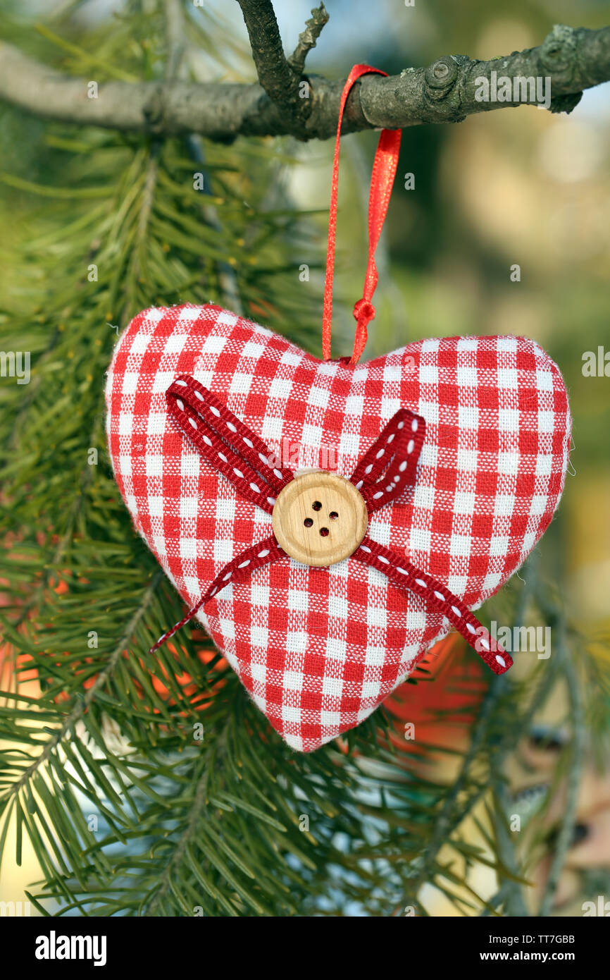 Tree branch with heart decoration on nature background Stock Photo - Alamy