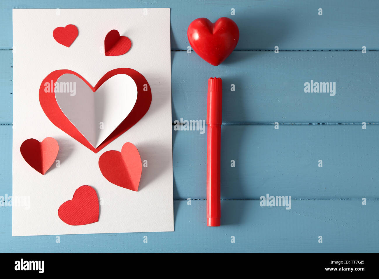 Beautiful hand made post card and pen on color wooden background Stock ...