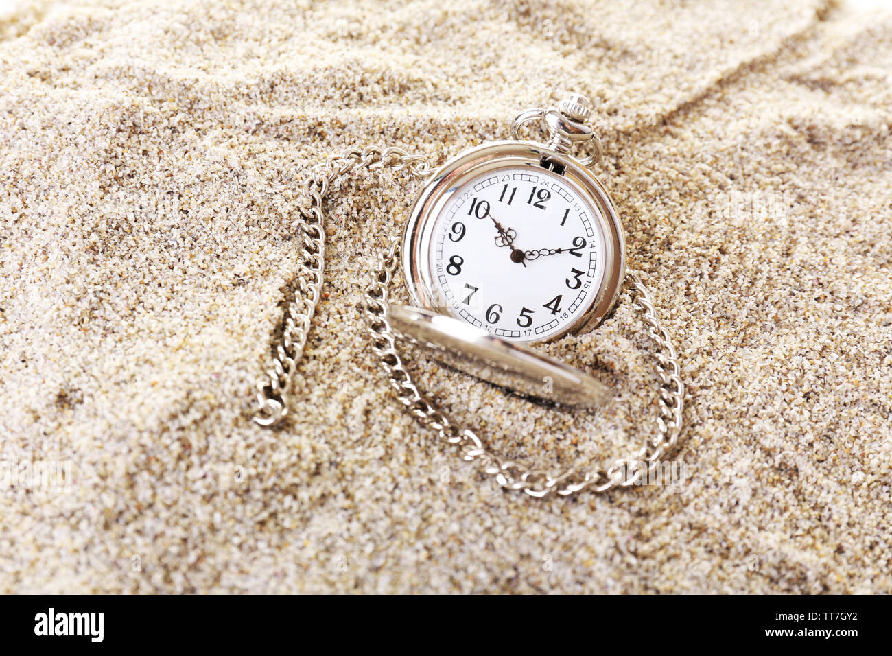 Pocket clock on beach hi-res stock photography and images - Alamy