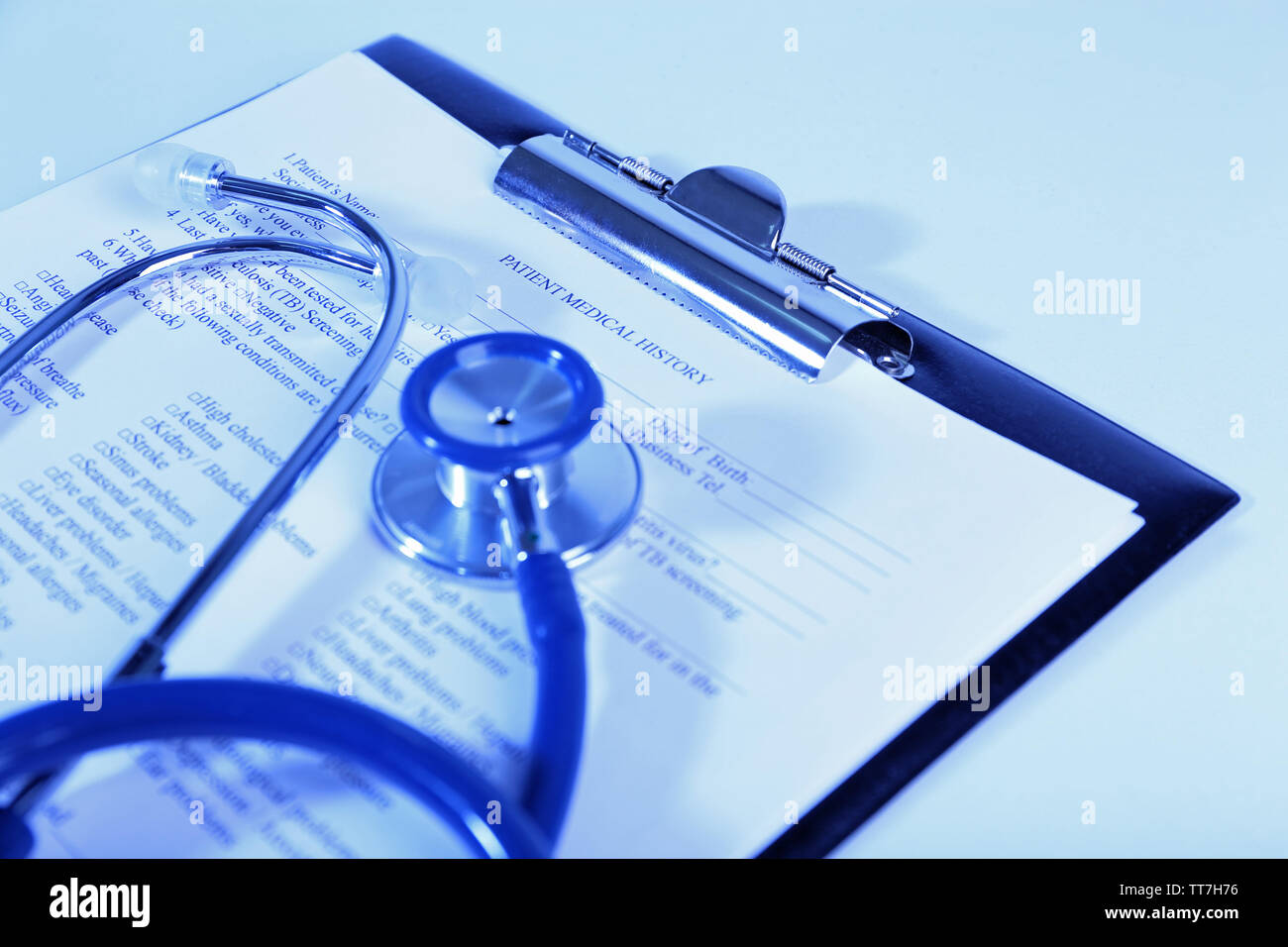 Medical history on clipboard with stethoscope on light background Stock ...