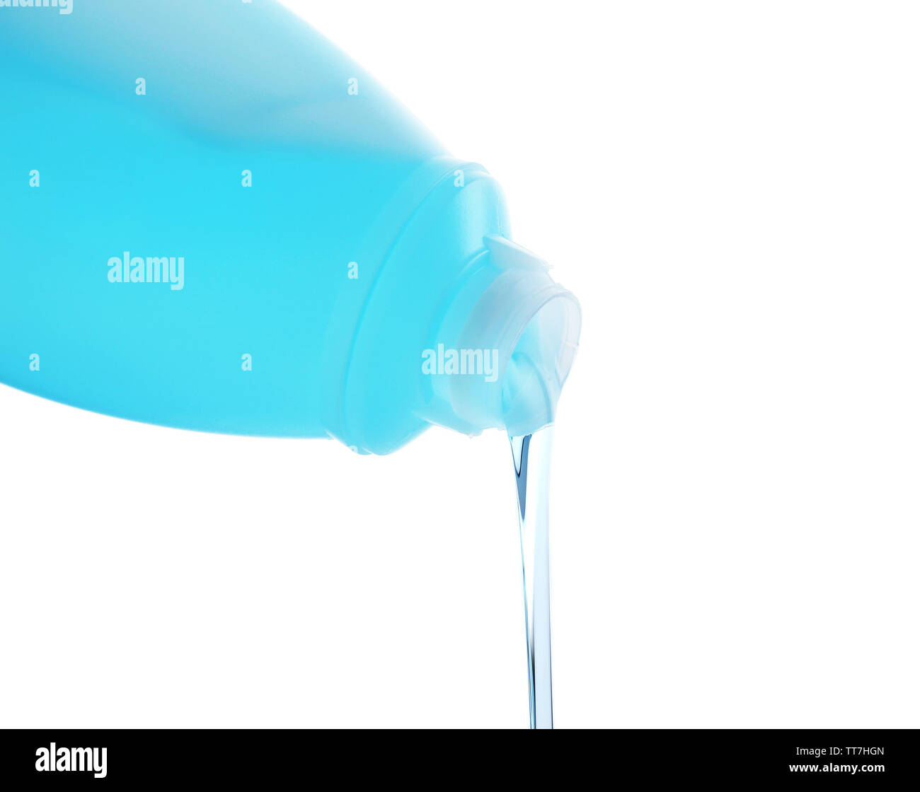 Cosmetic liquid pouring from bottle isolated on white Stock Photo - Alamy