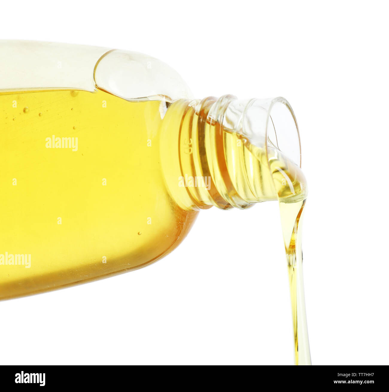 Cosmetic liquid pouring from bottle isolated on white Stock Photo - Alamy