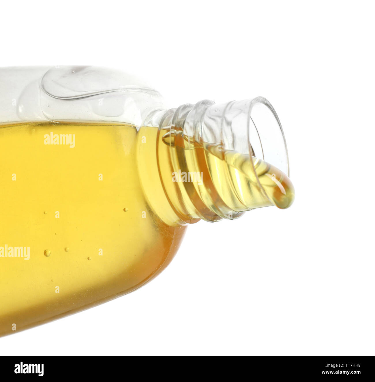 Cosmetic liquid pouring from bottle isolated on white Stock Photo - Alamy