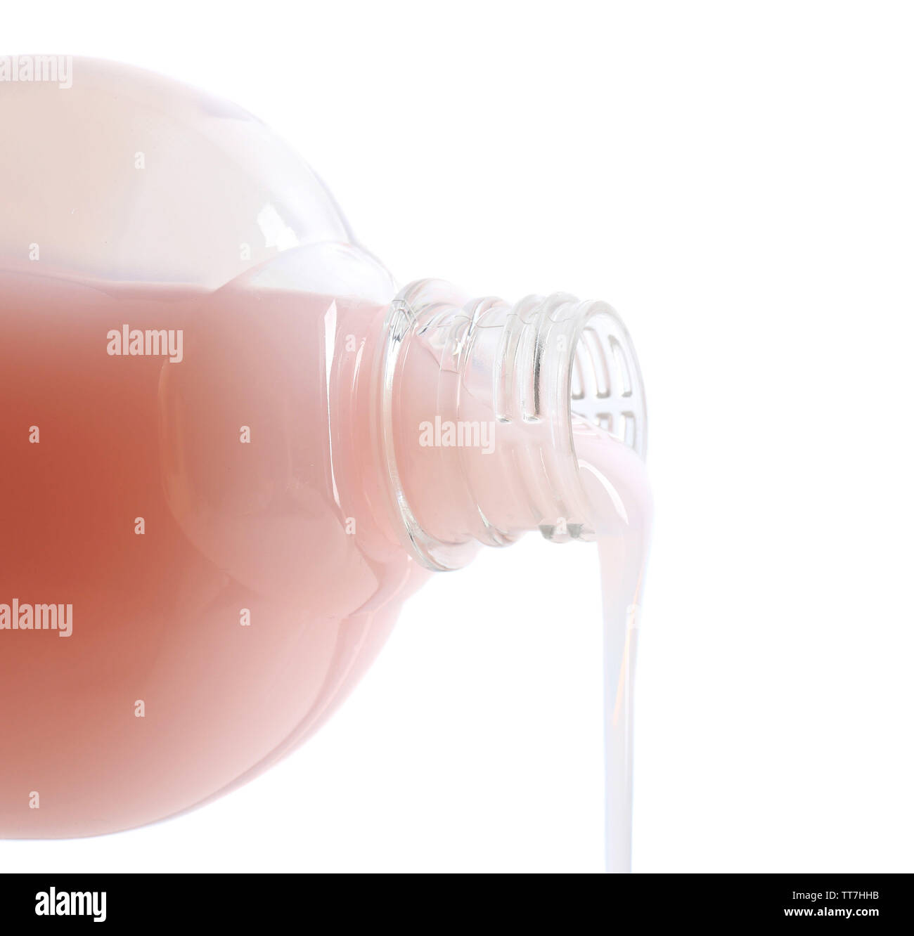 Cosmetic liquid pouring from bottle isolated on white Stock Photo - Alamy