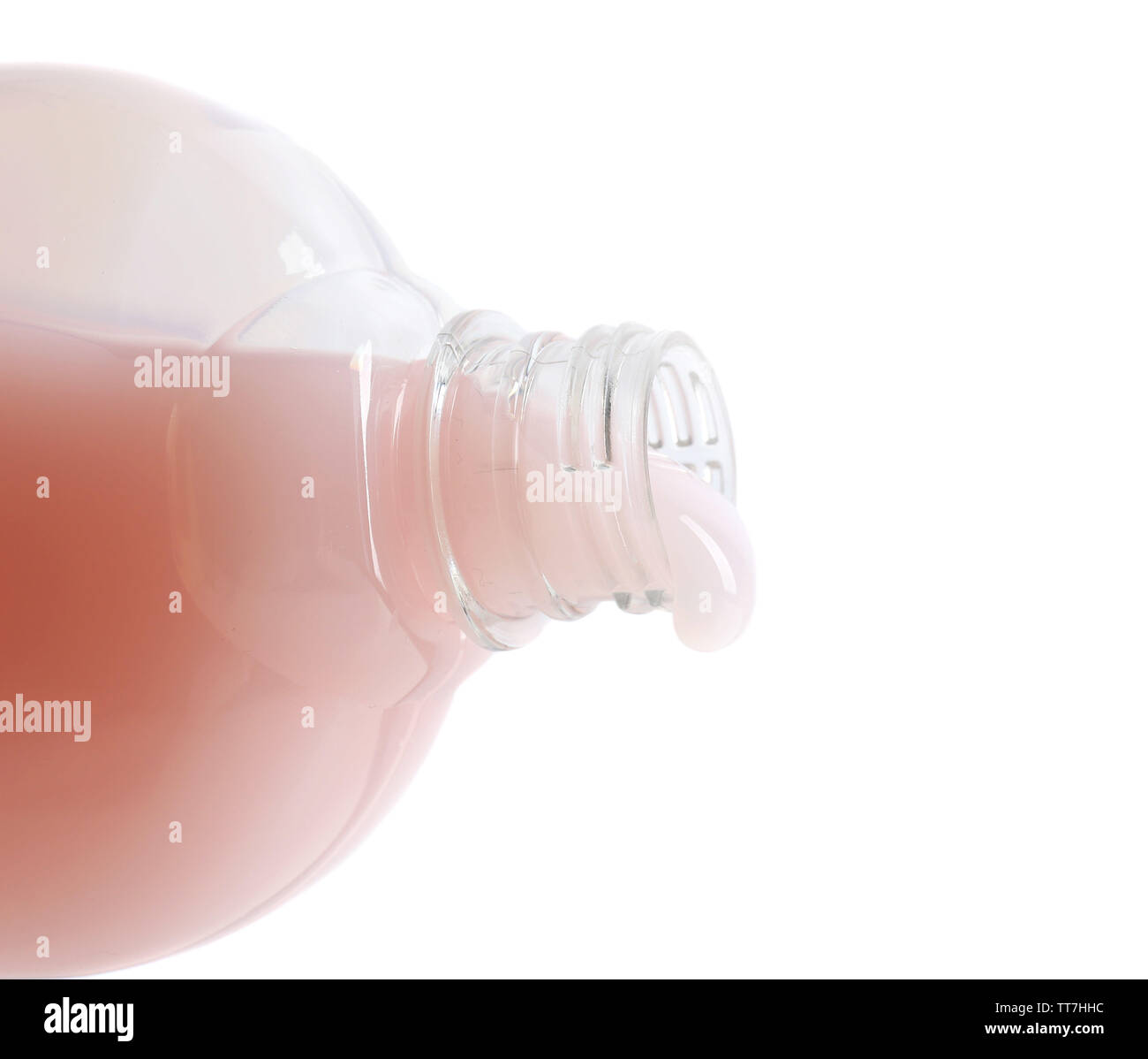 Cosmetic liquid pouring from bottle isolated on white Stock Photo - Alamy