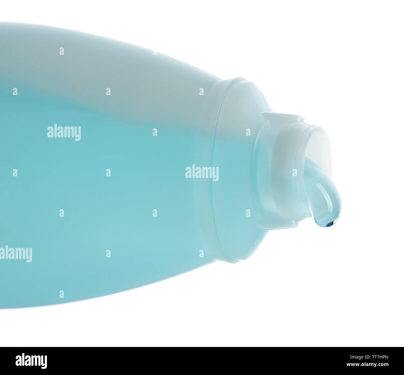 Cosmetic liquid pouring from bottle isolated on white Stock Photo - Alamy