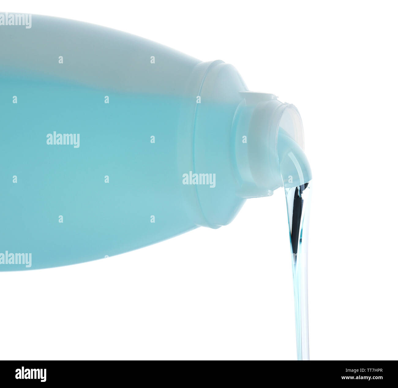 Cosmetic liquid pouring from bottle isolated on white Stock Photo - Alamy