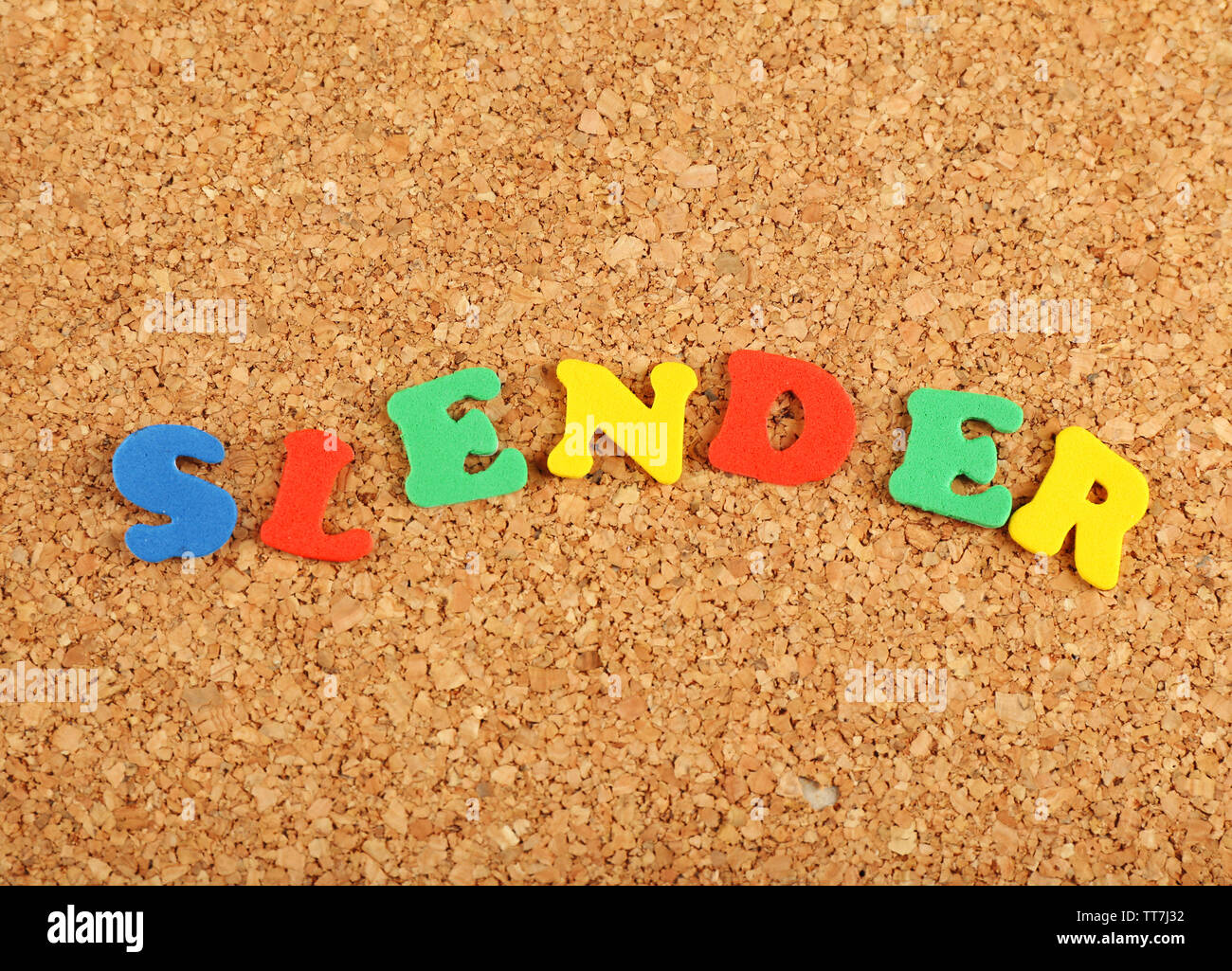 Slender word on cork board background Stock Photo - Alamy