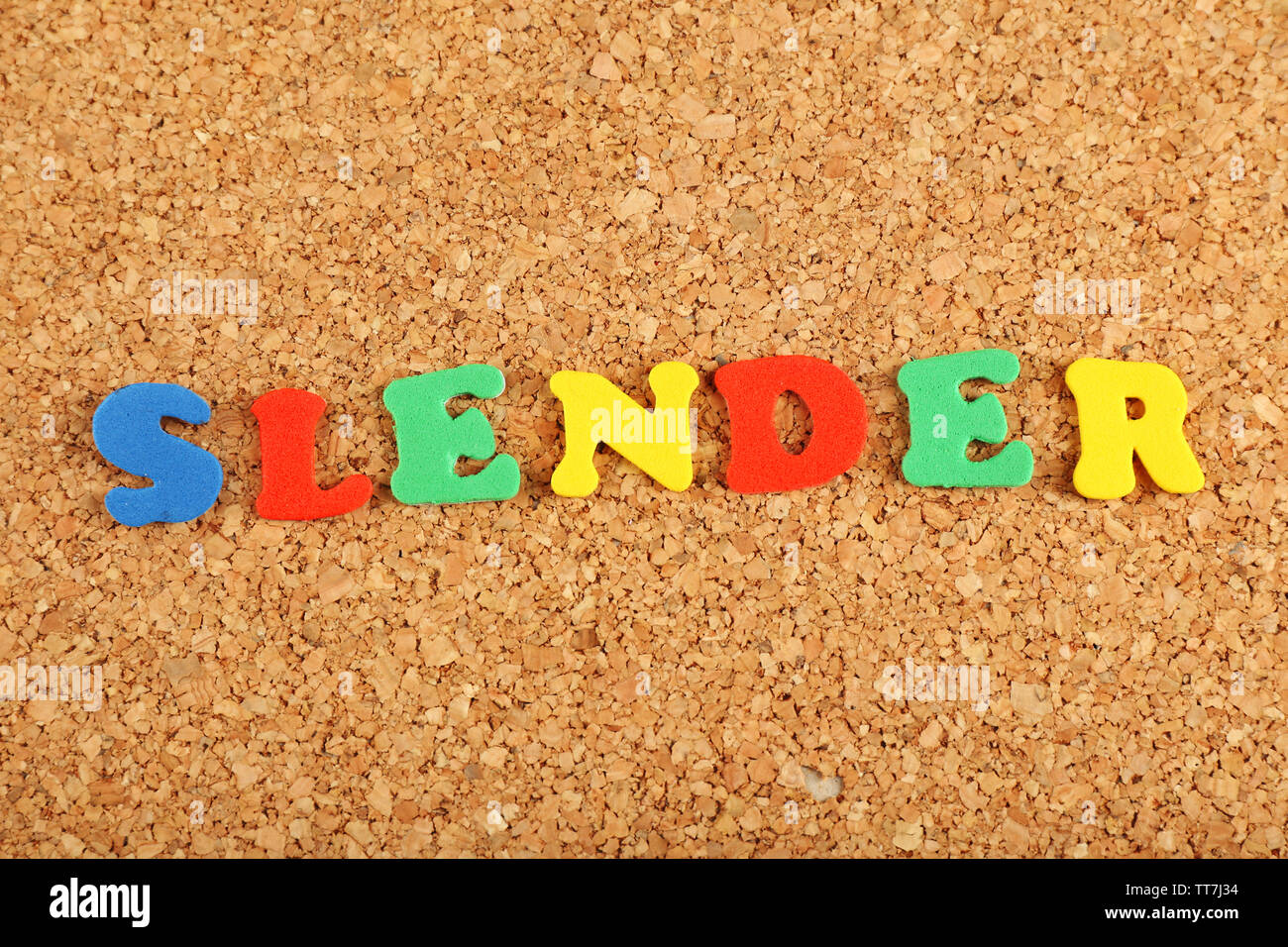 Slender word on cork board background Stock Photo - Alamy