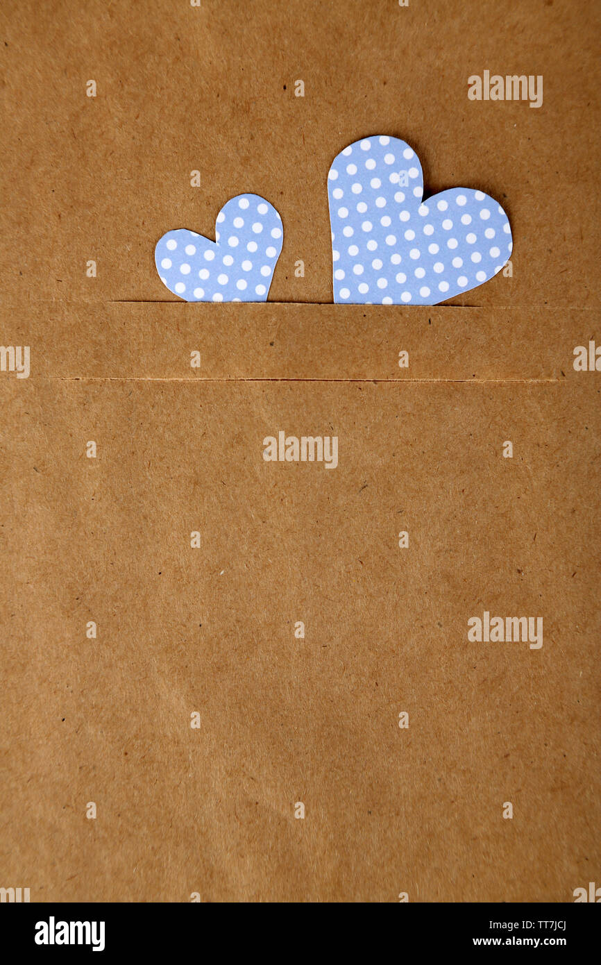 Paper hearts on brown background, close up Stock Photo - Alamy