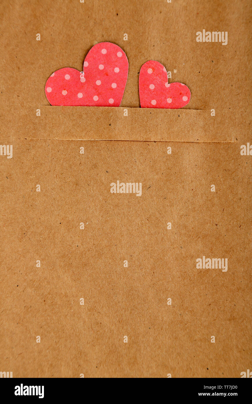 Paper hearts on brown background, close up Stock Photo - Alamy