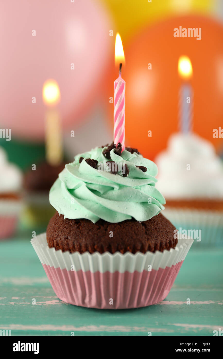 Delicious birthday cupcakes on table on bright background Stock Photo ...