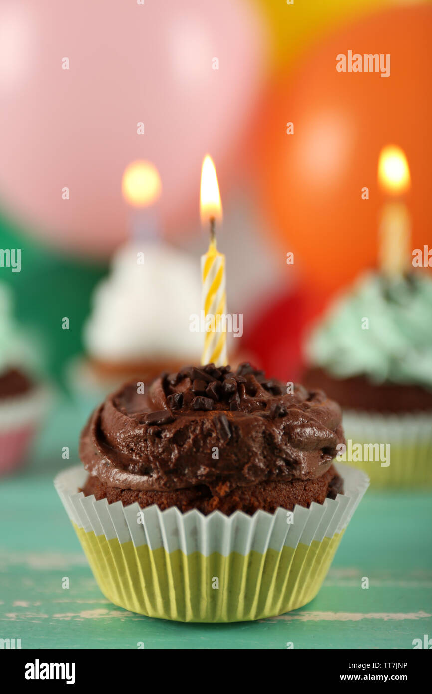 Delicious birthday cupcakes on table on bright background Stock Photo ...